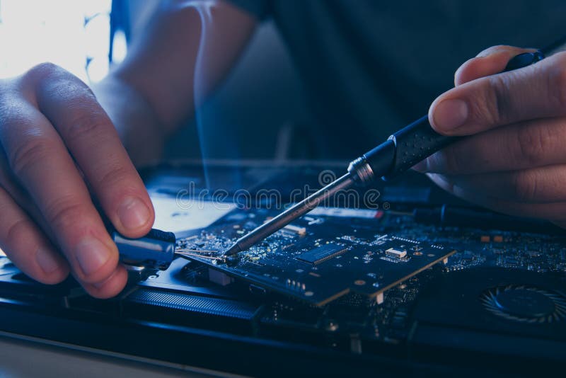 Computer Hardware Engineering. Developer Soldering Electronic Component ...
