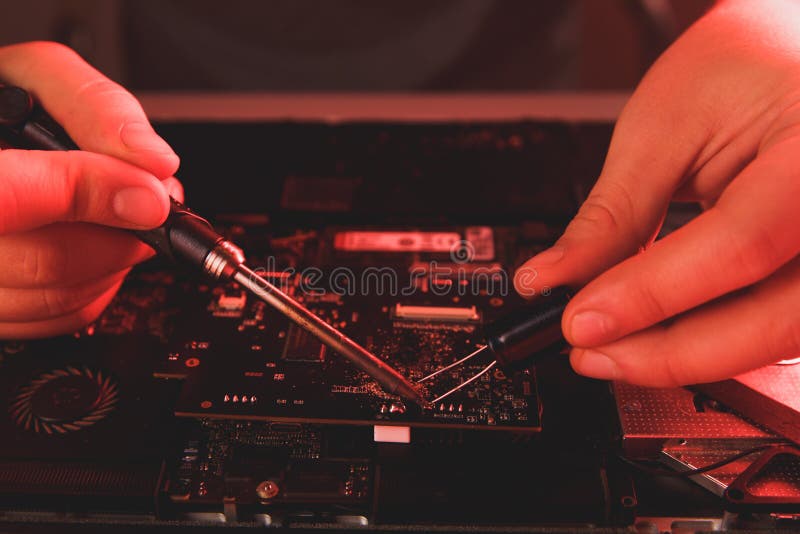Computer Hardware Engineering. Developer Soldering Electronic Component ...