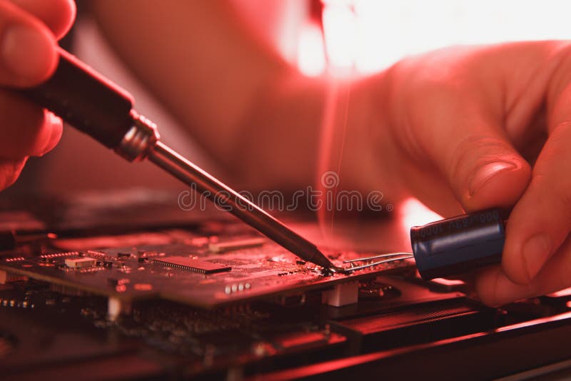 Computer Hardware Engineering. Developer Soldering Electronic Component ...