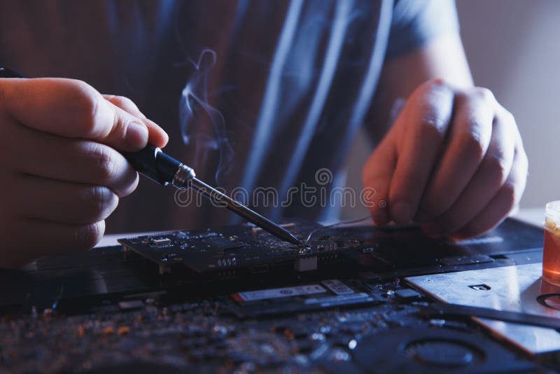 Computer Hardware Engineering. Developer Soldering Electronic Component ...