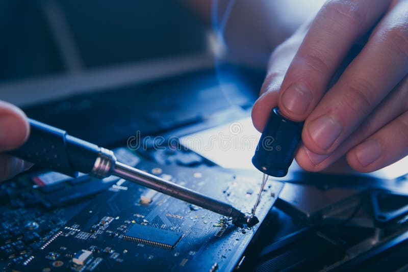 Computer Hardware Engineering. Developer Soldering Electronic Component ...
