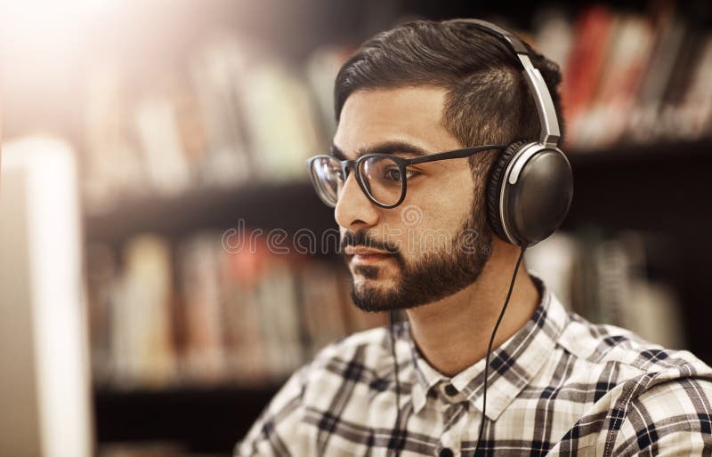 Computer, Headphones and Indian Man in Library for Reading, Elearning ...