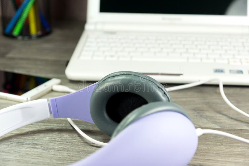 A Computer and the Headphones Stock Image - Image of playlist, music ...