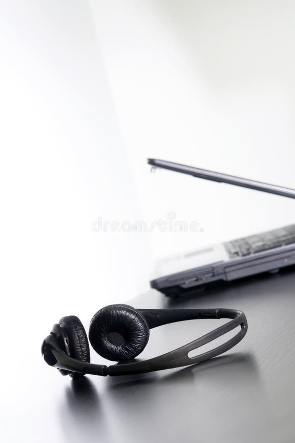 Computer and Headset on the Table, Nothing Else. Stock Image - Image of ...