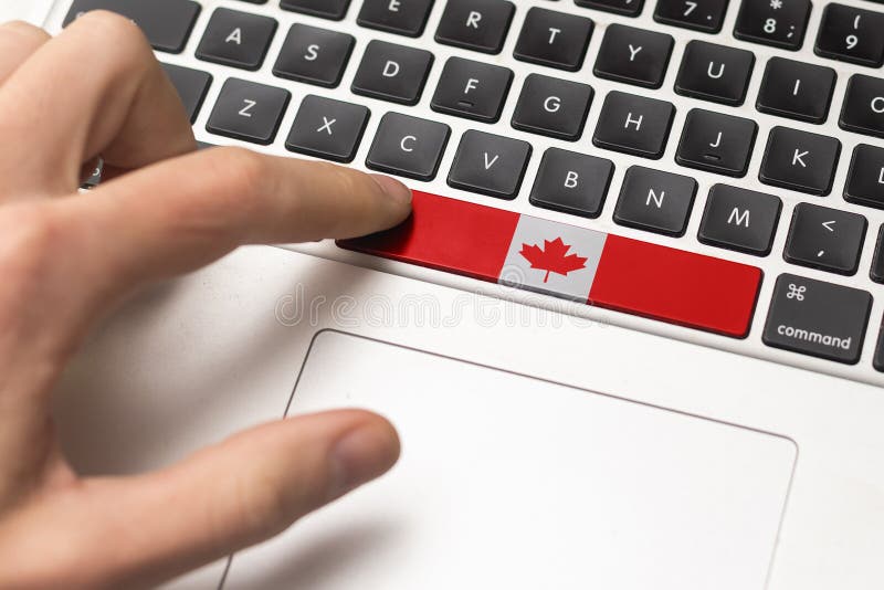 Computer Key with the Canada on it. Male Hand Pressing Computer Key ...