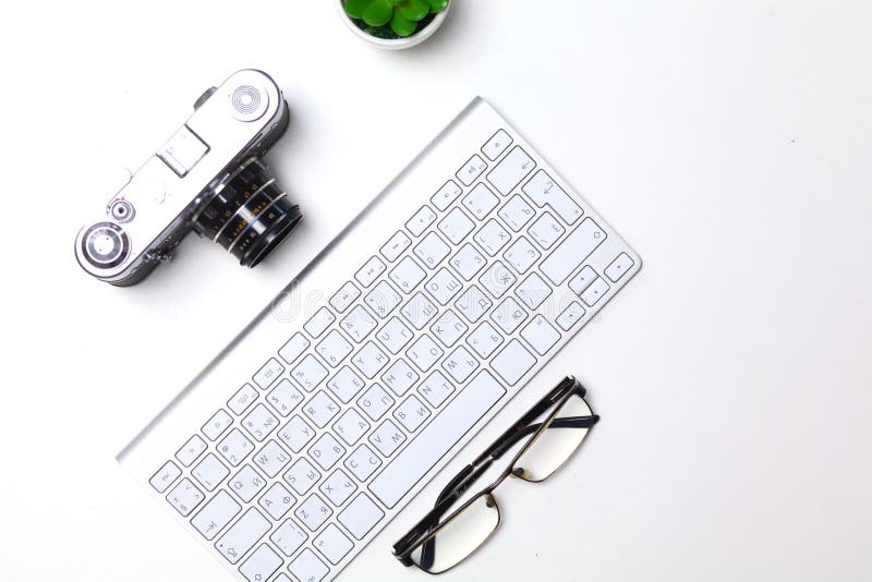 Computer Keyboard, Cactus and Camera Lie on Table Stock Photo - Image ...