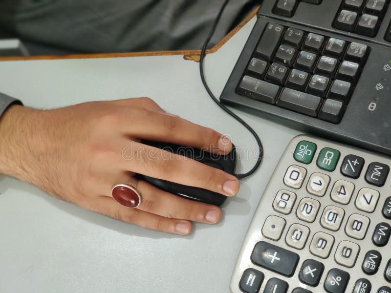 Computer Keyboard, Calculator on Table, Man Hand on Computer Mouse ...