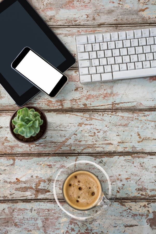 Computer Keyboard, Digital Tablet, Smartphone, Pot Plant and Coffee Cup ...