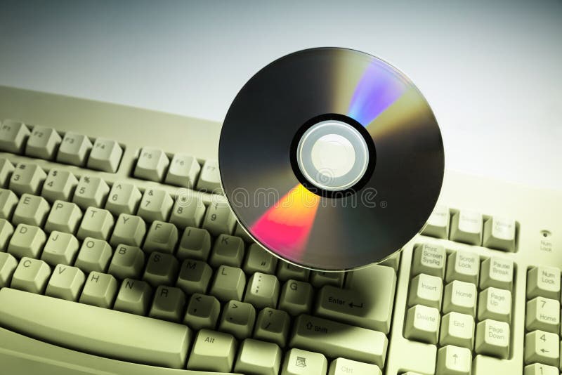 Computer Keyboard and DVD Disk Stock Image - Image of storage, empty ...