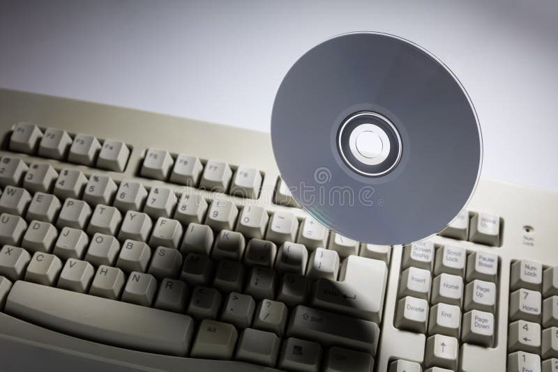 Computer Keyboard and DVD Disk Stock Image - Image of memory, data ...