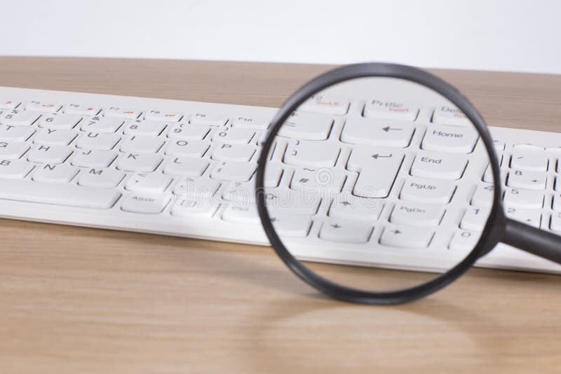 Computer Keyboard Enlarged through a Magnifier Stock Photo - Image of ...