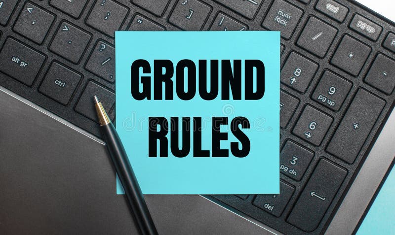 The Computer Keyboard Has a Pen and a Blue Sticker with the Text GROUND ...