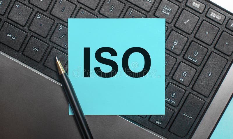 The Computer Keyboard Has a Pen and a Blue Sticker with the Text ISO ...
