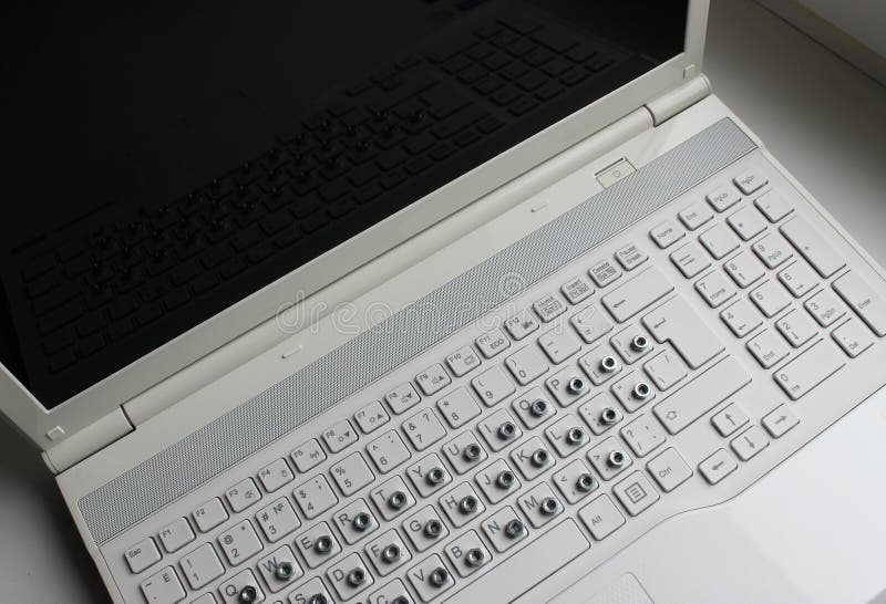 Steel Hex Nuts on the White Keyboard Cover a Cyrillic Characters Top ...