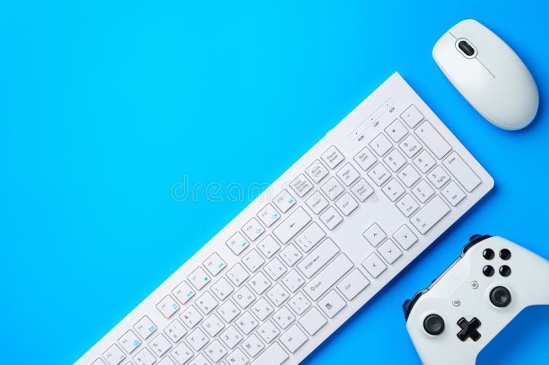 Computer Keyboard and Joystick on Blue Background Top View Stock Image ...