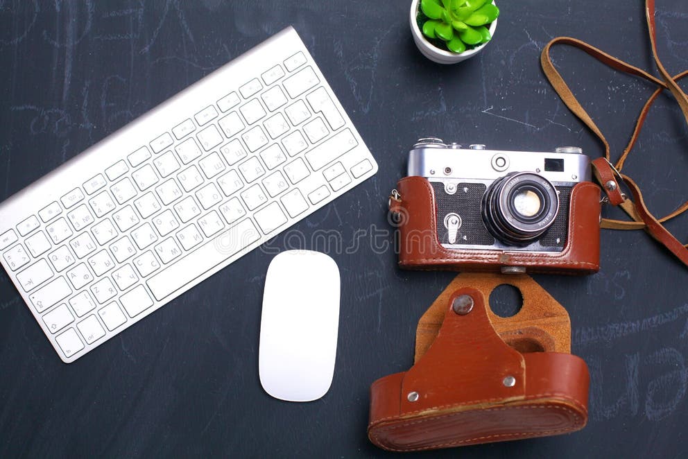 Computer Keyboard, Mouse and Camera Lie on a Black Table Stock Image ...