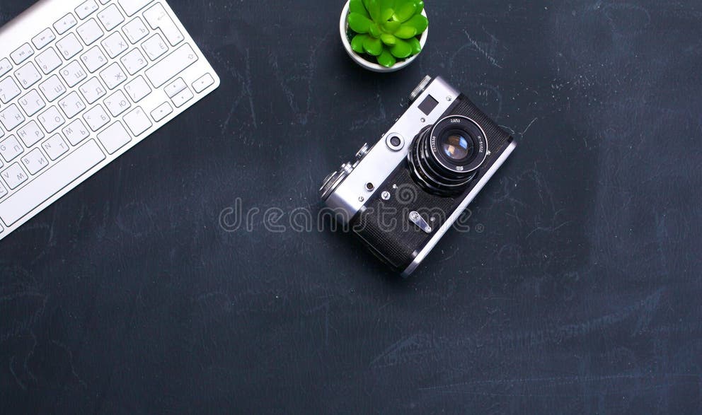 Computer Keyboard, Mouse and Camera Lie on a Black Table Stock Photo ...