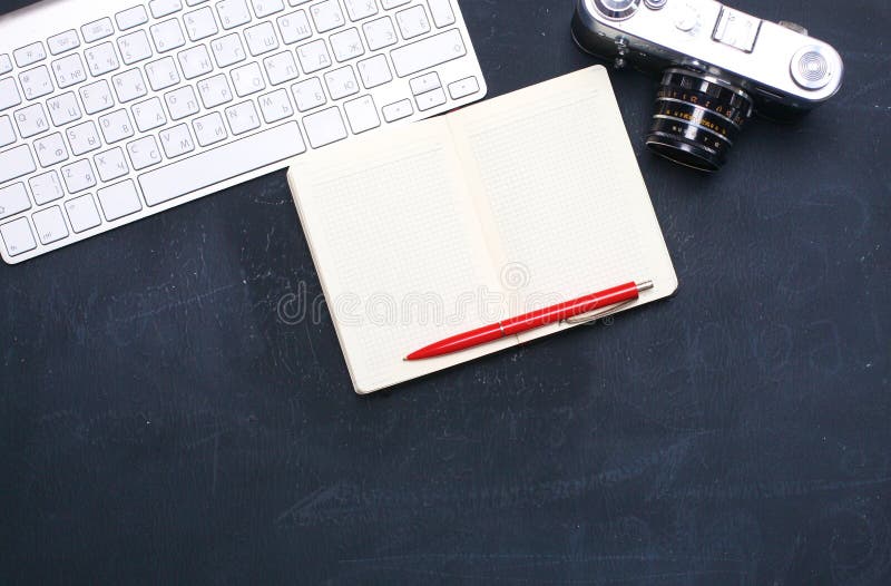 Computer Keyboard, Mouse and Camera Lie on a Black Table Stock Image ...
