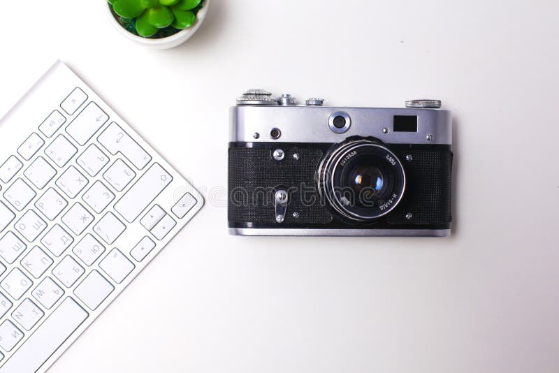 Computer Keyboard, Mouse and Camera Lie on a White Table Stock Photo ...