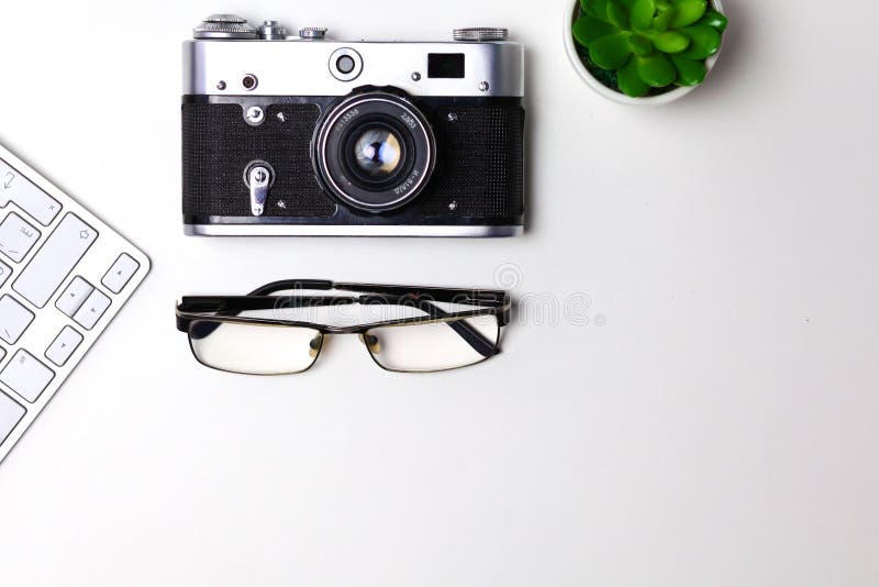 Computer Keyboard, Mouse and Camera Lie on a White Table Stock Image ...