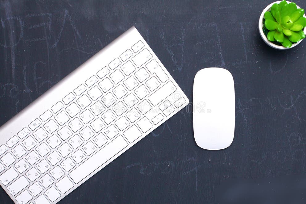 Computer Keyboard and Mouse Lie on a Black Table Stock Image - Image of ...