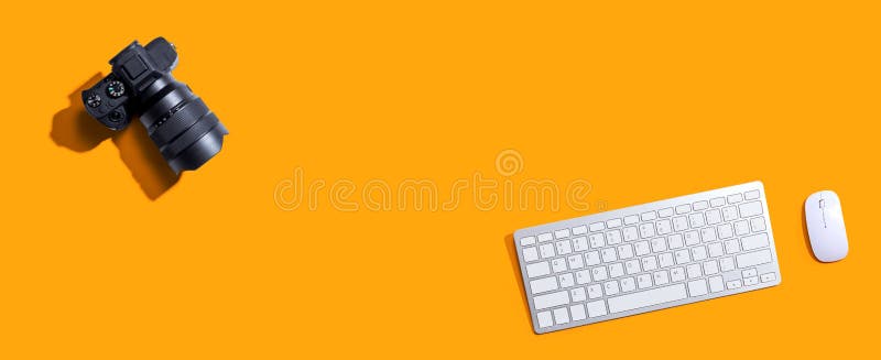 Computer Keyboard with a SLR Camera Stock Photo - Image of orange ...