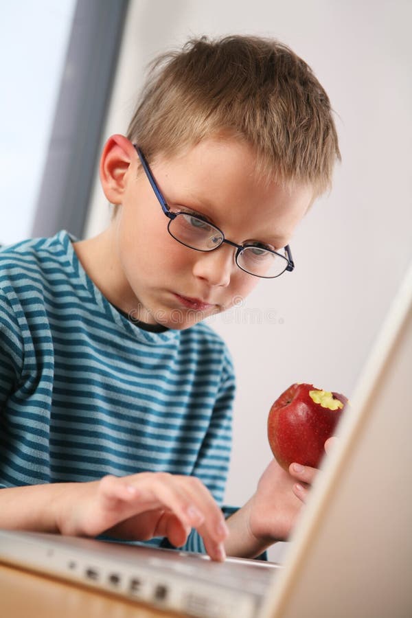 Computer kid. Eating apple stock photo. Image of computer - 9428156