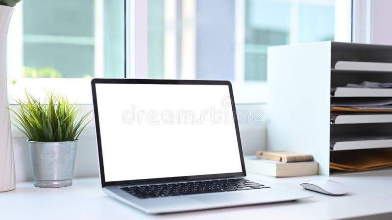 Laptop with Blank Screen, Plant and Book on Minimal Workspace. Stock ...