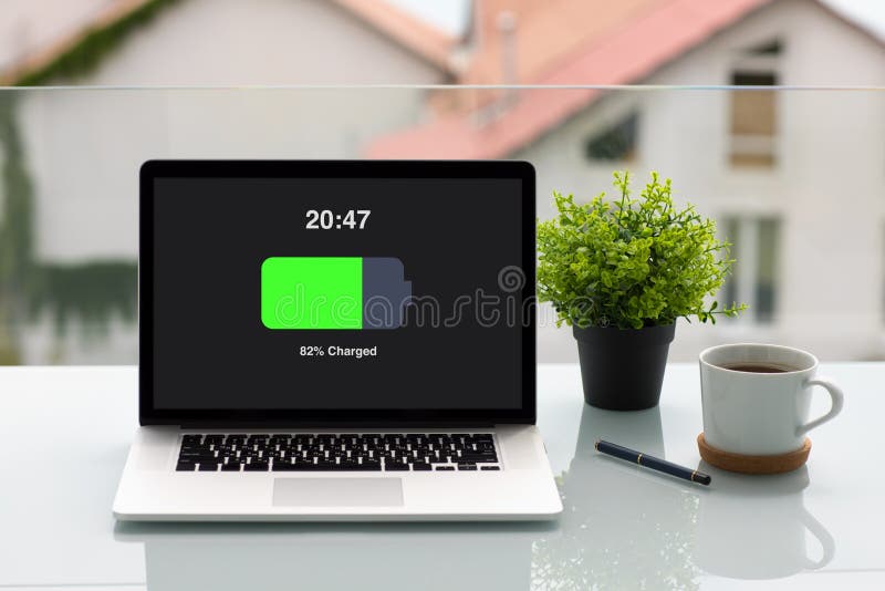 Computer Laptop with Charged Battery Screen on Table in Cafe Stock ...