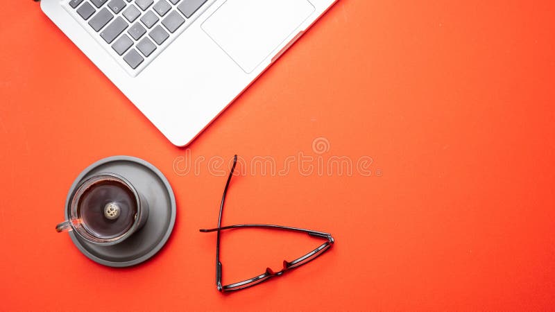 Computer Laptop and Mobile Phone on Orange Color Office Desk, Top View ...