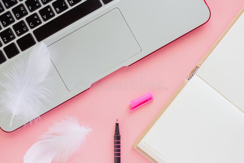 Computer Laptop with Opened Notebook and Office Paper Clip and Pen on ...