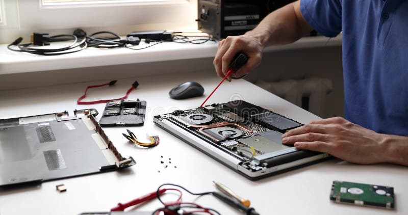 Computer Maintenance - Technician Blow Out Dust from Laptop Fan Stock ...