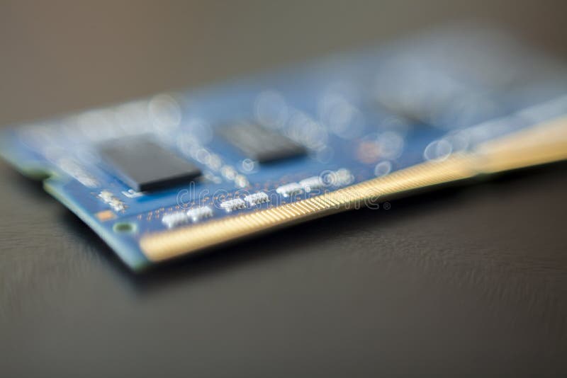 Computer Memory Chip Placed on Top of a Black Table. Connections and ...