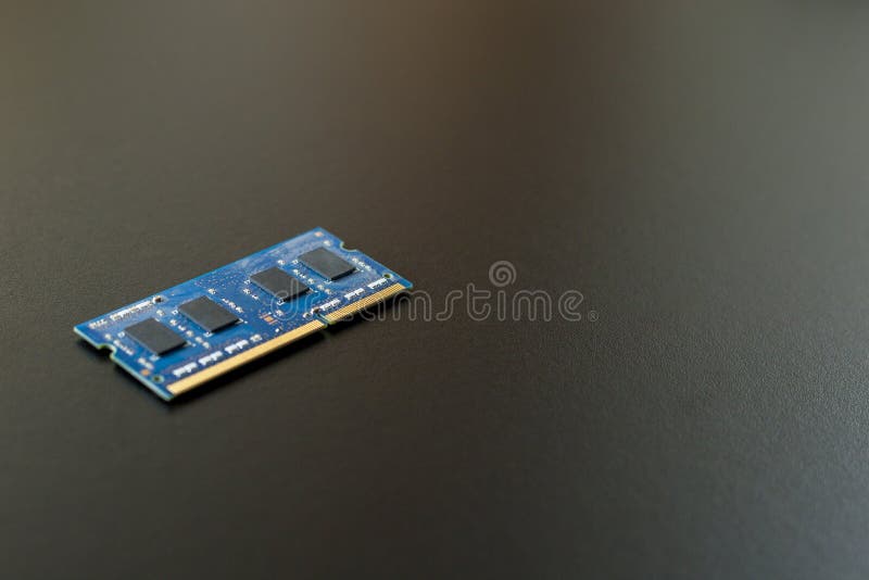 Computer Memory Chip Placed on Top of a Black Table. Connections and ...