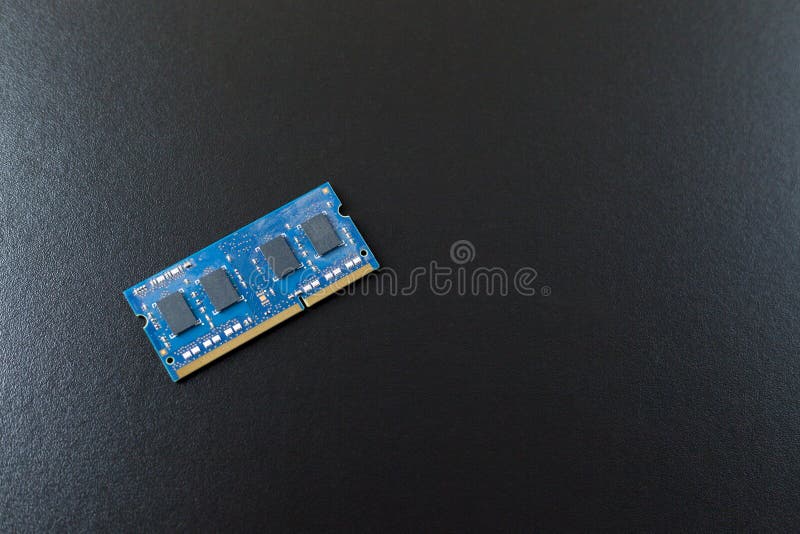 Computer Memory Chip Placed on Top of a Black Table. Connections and ...