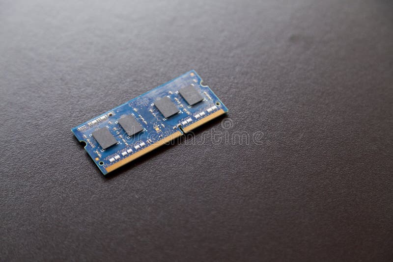 Computer Memory Chip Placed on Top of a Black Table. Connections and ...