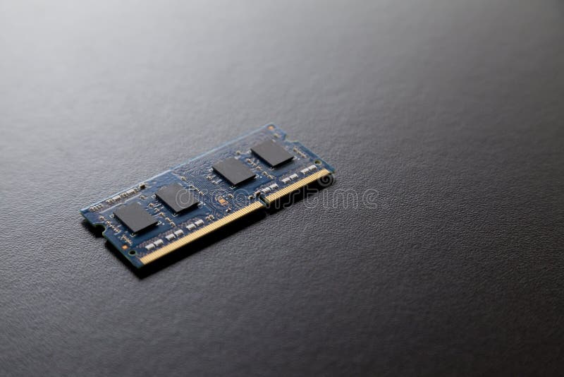 Computer Memory Chip Placed on Top of a Black Table. Connections and ...