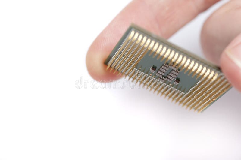 Close Up Macro View of a Computer Microprocessor Held between the ...