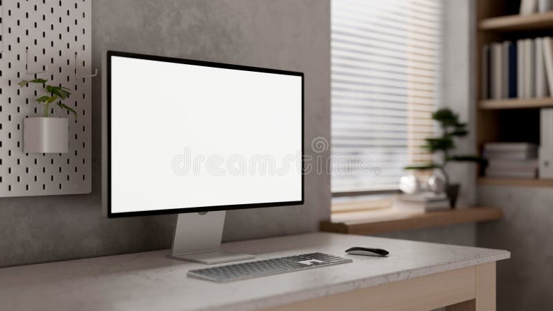A Computer Mockup on a Table Against the Cement Wall in a Modern Loft ...