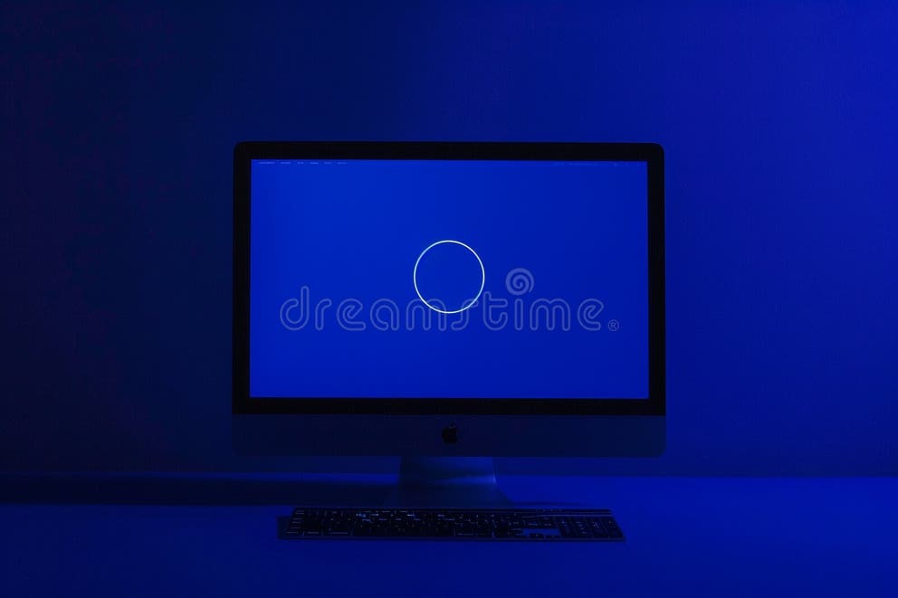 A Computer Monitor Displays a Blue Screen with a Circle on it Stock ...