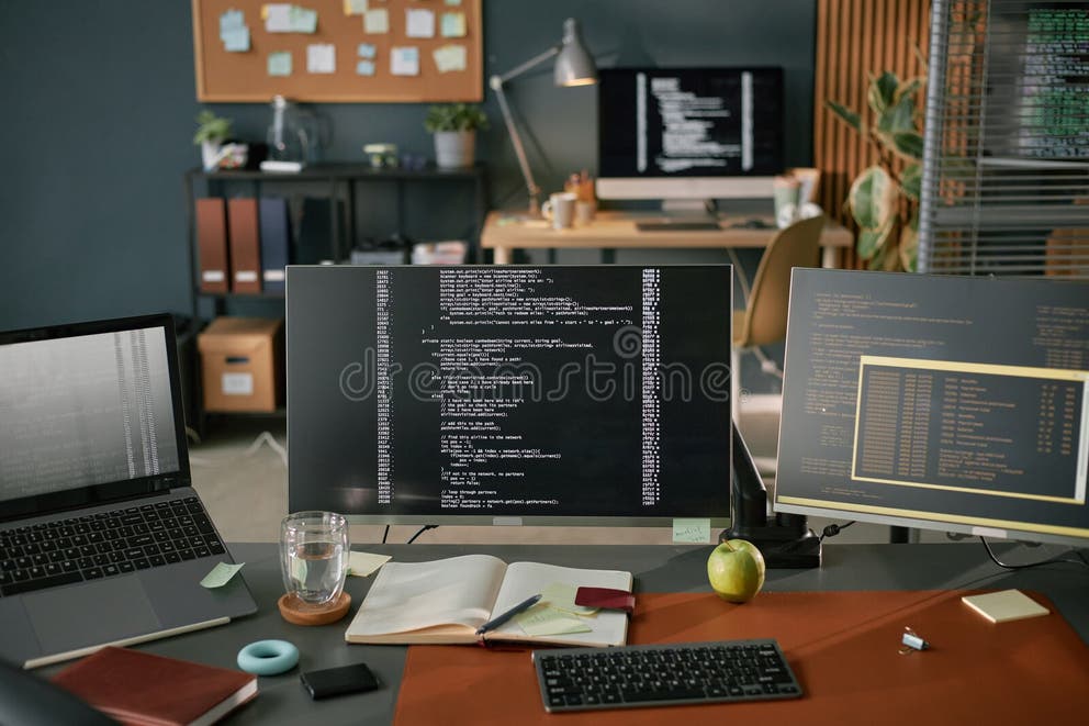 Computer Monitors Displaying Programming Code on Desk in Modern Office Stock Image - Image of ...