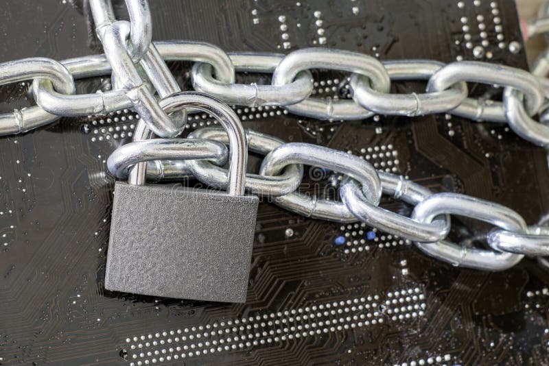 The Computer Motherboard is Wrapped with an Iron Chain Locked with a ...