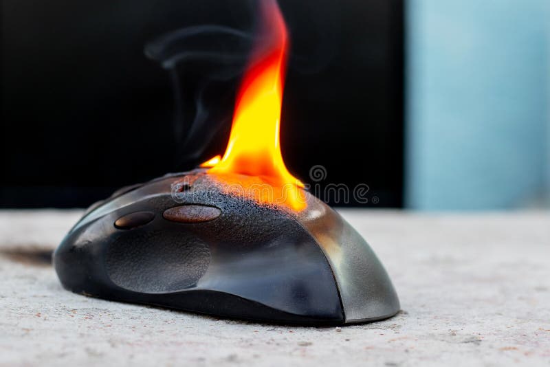 Computer Mouse in Flames. Careless Handling of Equipment, Fire Stock ...