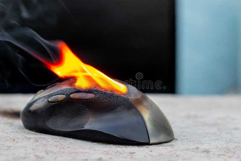 Computer Mouse in Flames. Careless Handling of Equipment, Fire Stock ...
