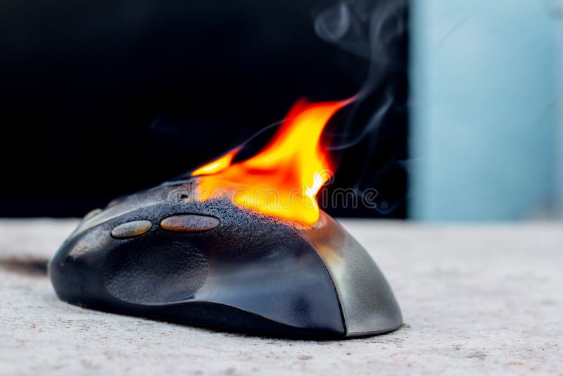Computer Mouse in Flames. Careless Handling of Equipment, Fire Stock ...