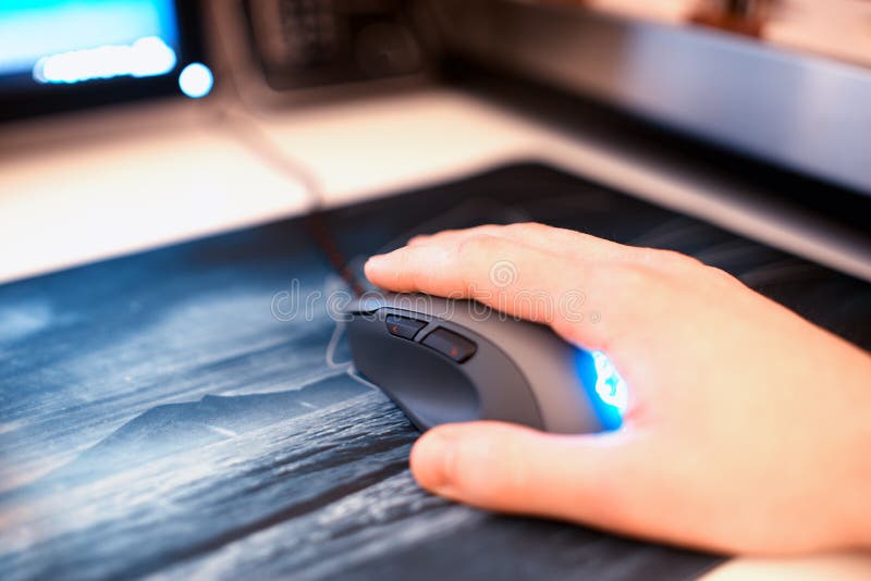 Computer Mouse with Human Hand on Mousepad Bokeh Backdrop Stock Image ...