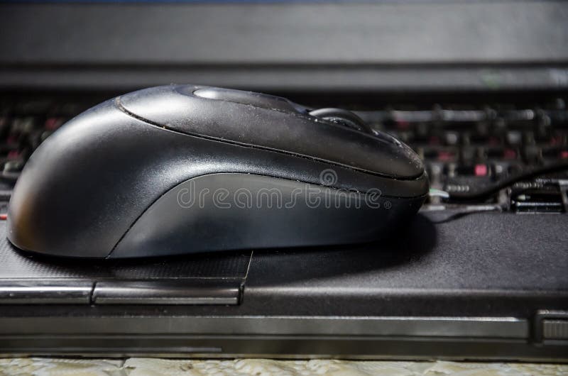Computer Mouse on Laptop Keyboard Close-up Stock Photo - Image of ...