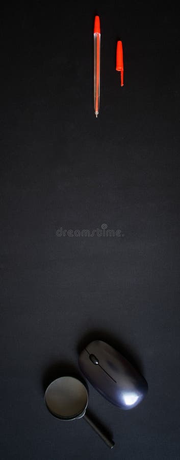 Computer Mouse, Magnifier and Red Ballpoint Pen on a Black Background ...