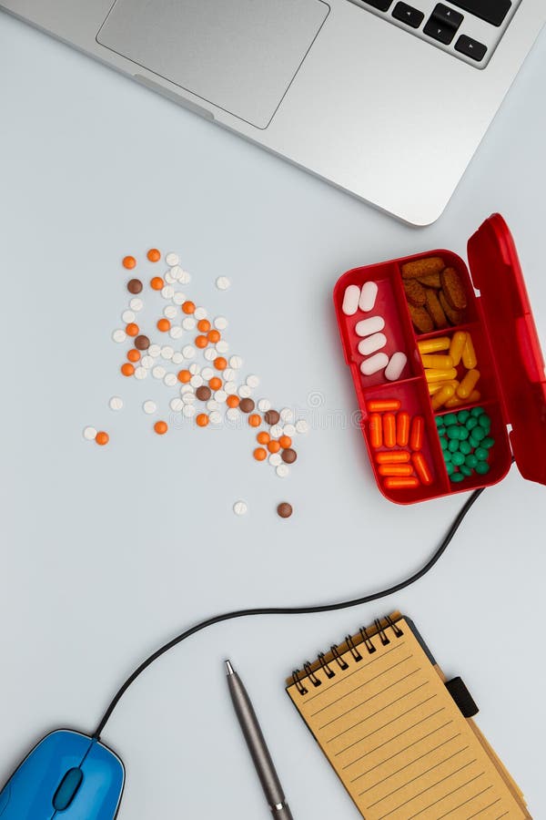 Computer with Mouse, daily Organizer, Pills on White Desk Stock Photo ...