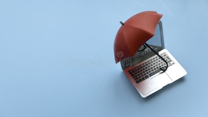 Computer and Network Security Concept. Red Umbrella Cover the Laptop ...